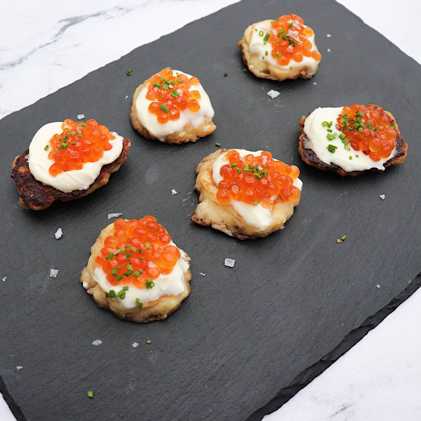 Potato Blinis topped with Keta Ikura – Wild For Salmon